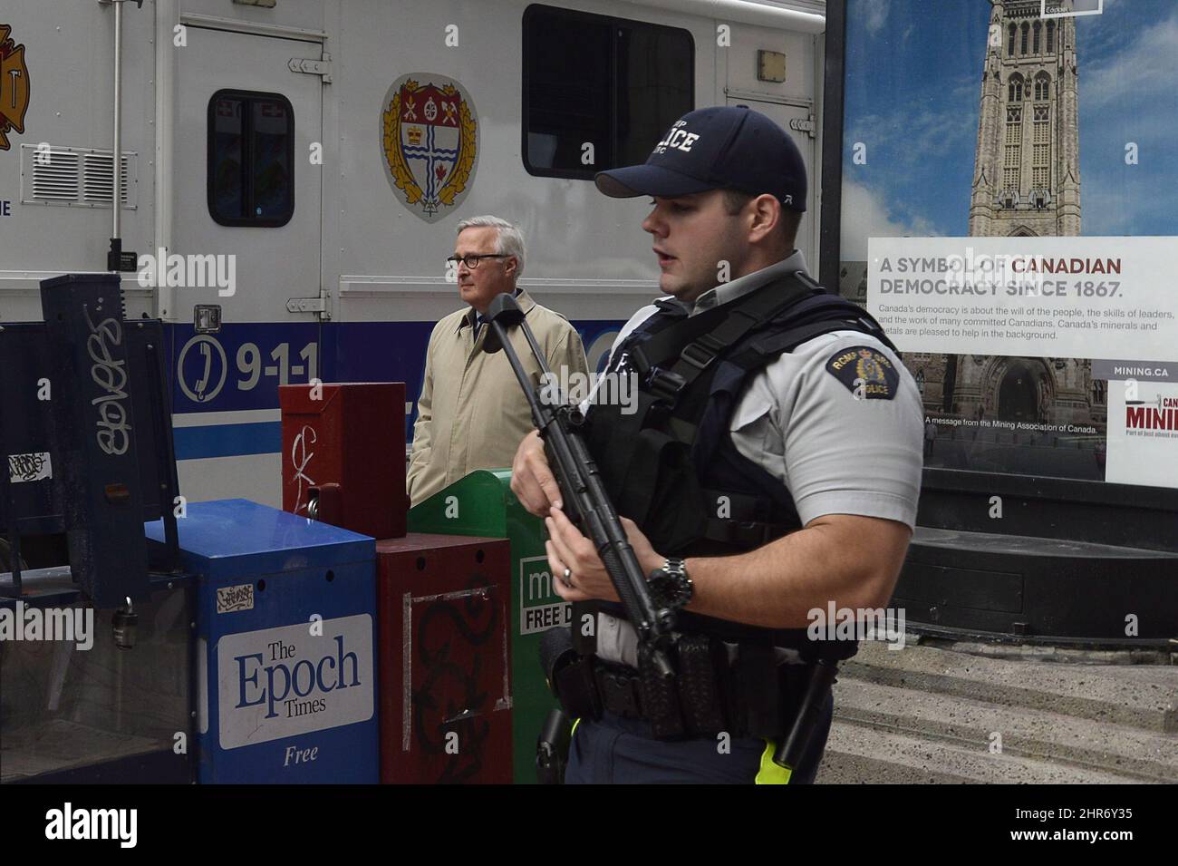 CSIS (secret service) head Richard Fadden walks past an RCMP officer as ...