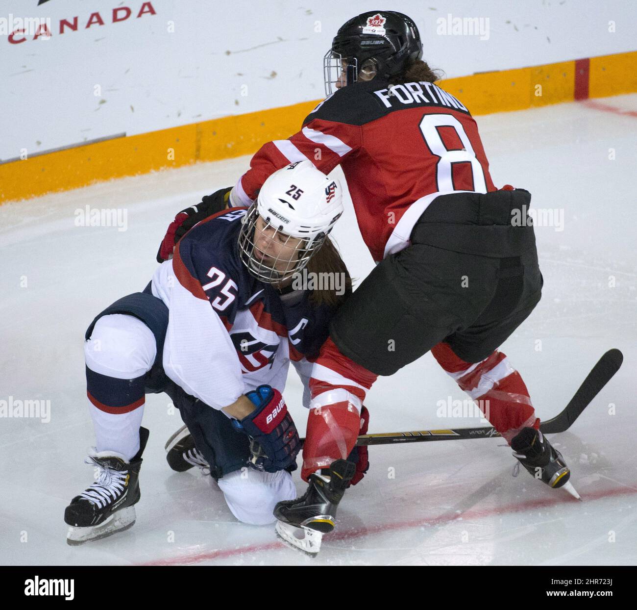 Canada's Laura Fortino fights for control of the puck with United ...