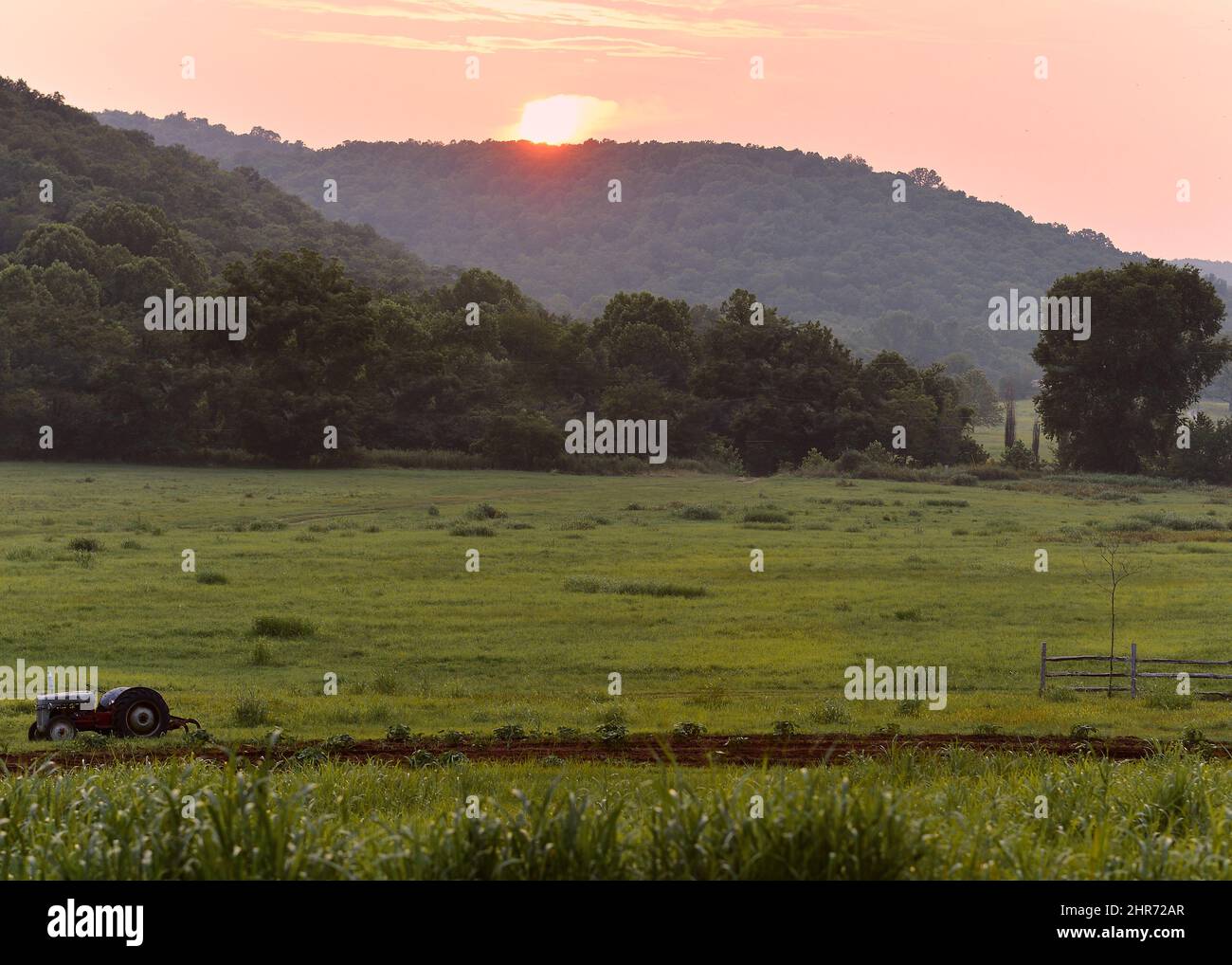 SUNSET BEHIND MOUNTAINS Stock Photo - Alamy