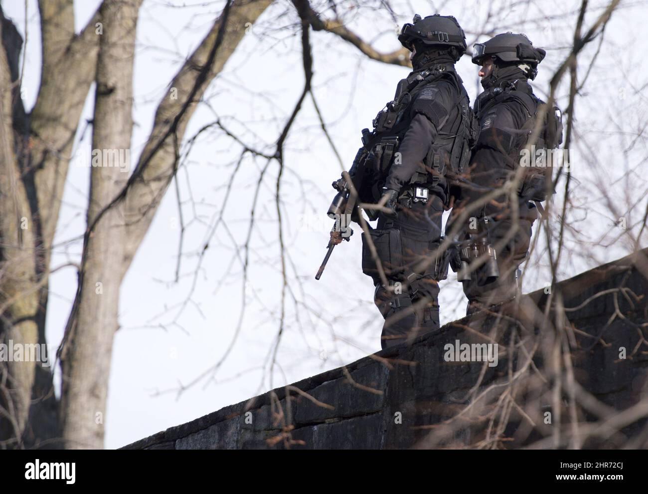 Members of the Quebec City police SWAT team are posted on the fortified ...
