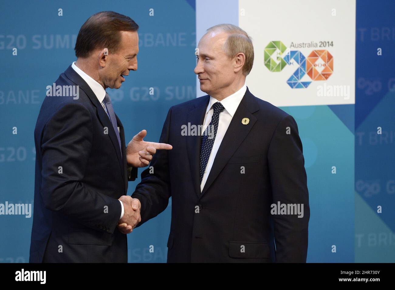 Russian President Vladimir Putin shakes hands with Australian Prime ...