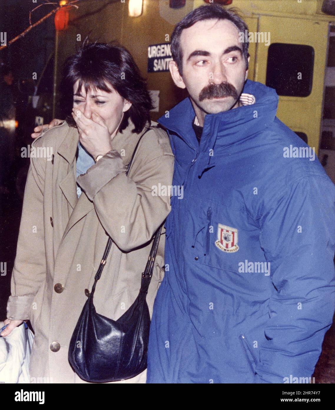 A woman is overwhelmed as she is escorted from the Montreal ...