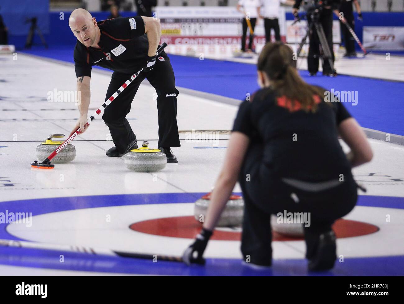 Team Canada's Ryan Fry, left, and Emma Miskew compete in the mixed ...