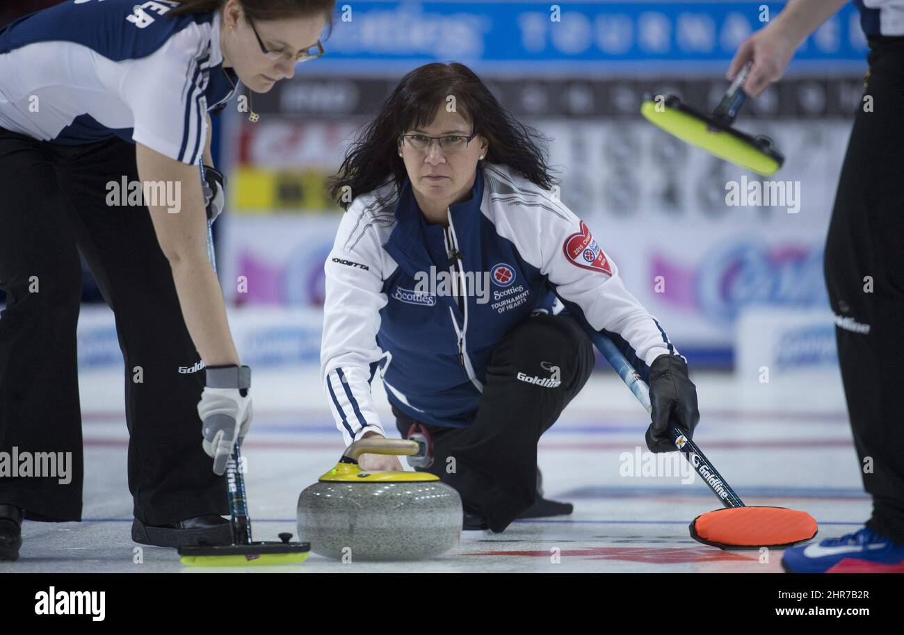 Nova Scotia lead Jennifer Baxter, left, looks on as skip Mary-Anne ...