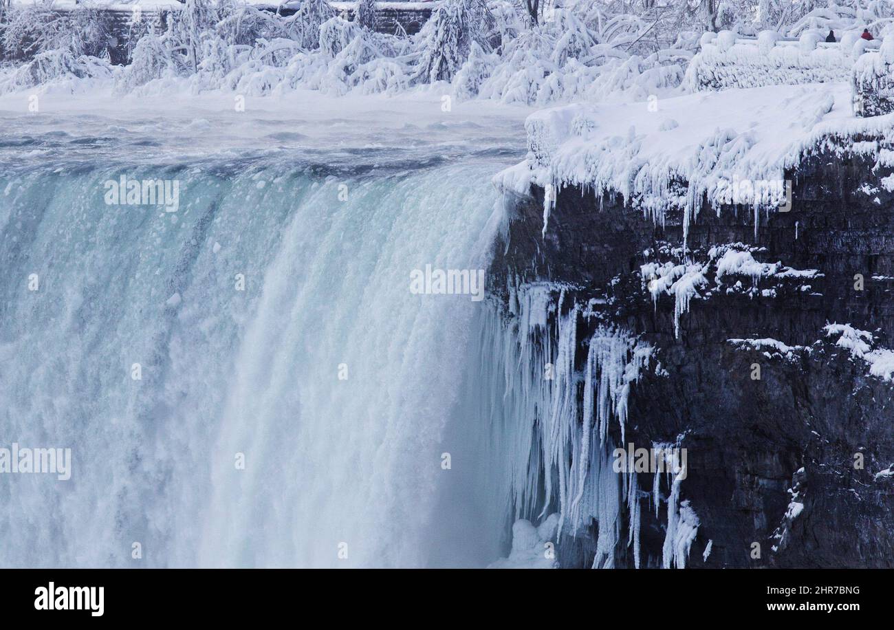 Visitors look over masses of ice formed around the Canadian 'Horseshoe ...