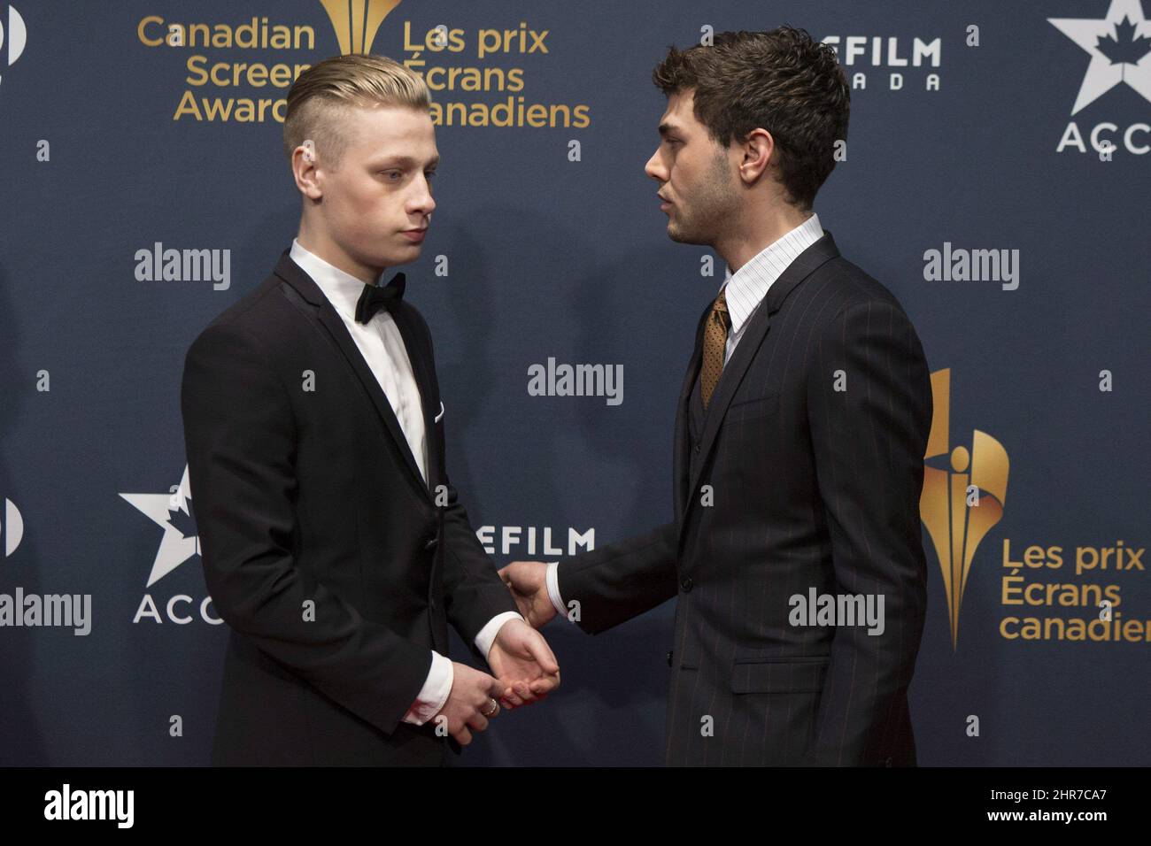 Antoine Oliver Pilon (left) and Xavier Dolan arrive on the red carpet ...