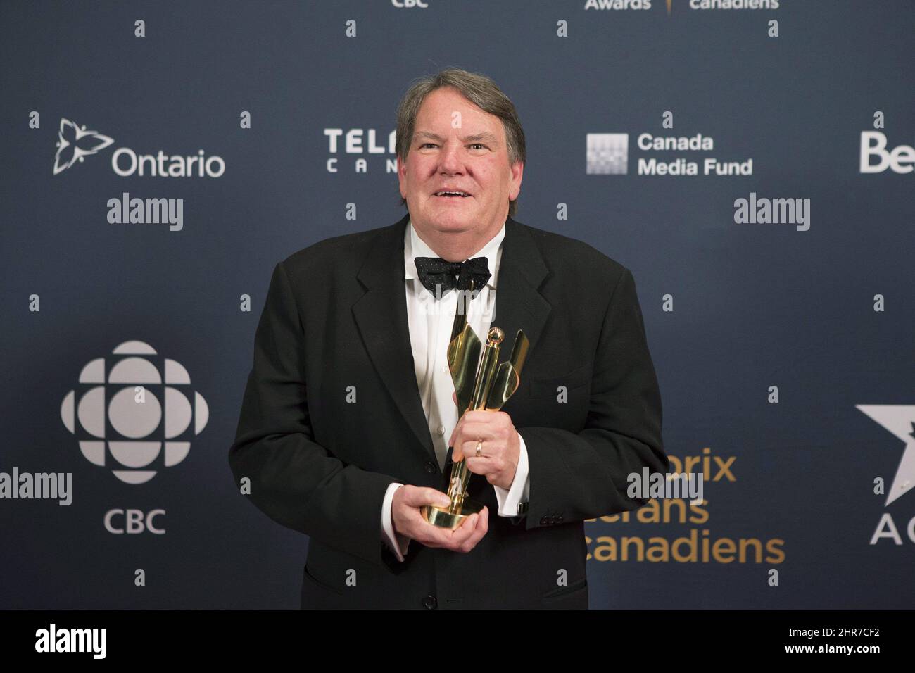 Don Carmody poses with the Cineplex Golden Screen Award for feature ...