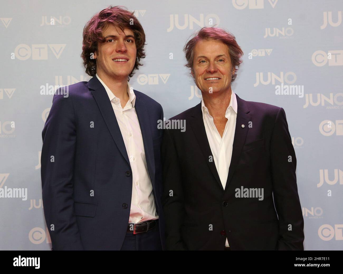 Father and son Jim, right, and Devin Cuddy pose on the red carpet ...