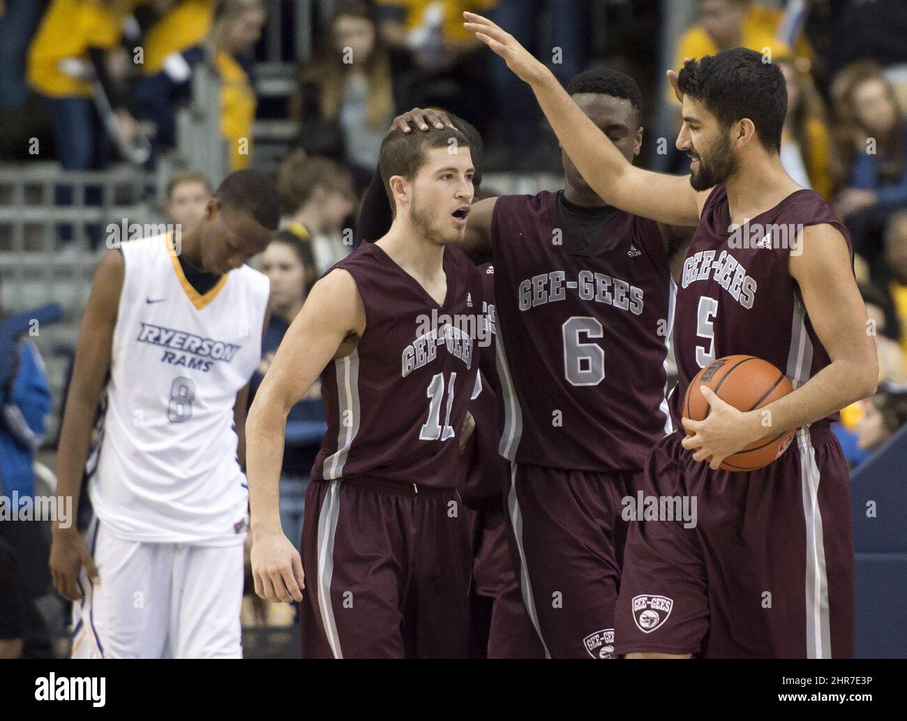 Ottawa Gee Gees' Michael L'Africain (11), Calem Agada (6) and Mehdi ...