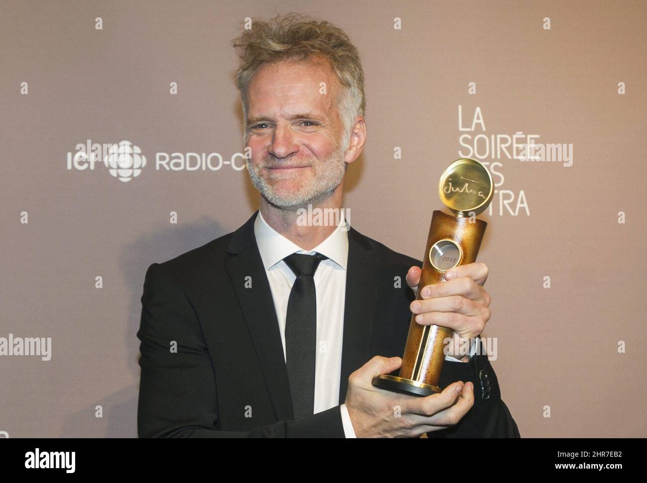 Andre Turpin holds up his trophy for best cinematography at the Jutra ...