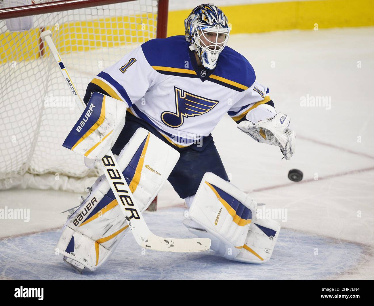 St. Louis Blues goalie Brian Elliott deflects the puck during first ...