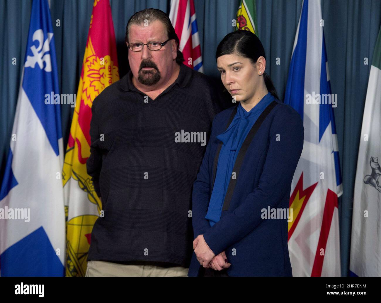 Chris Huck stands with his daughter Stephanie Huck after she talked ...