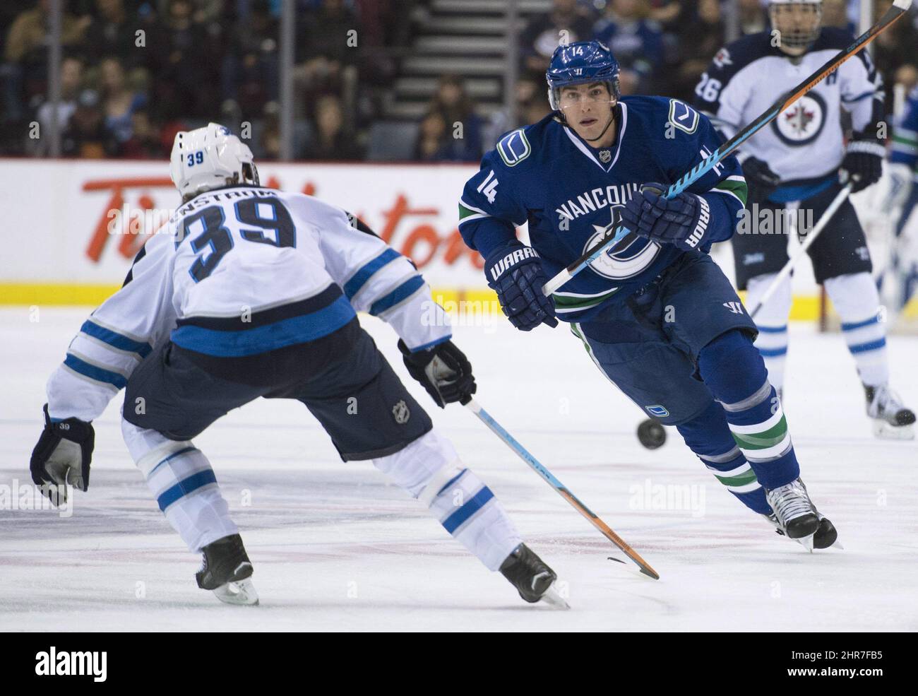 Vancouver Canucks' Alex Burrows (14) tries to get the puck past ...