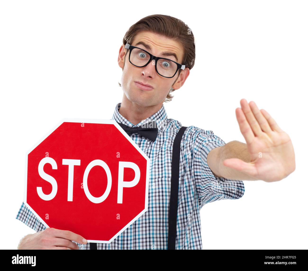 You better stop. Portrait of a stern-looking man holding out his hand ...