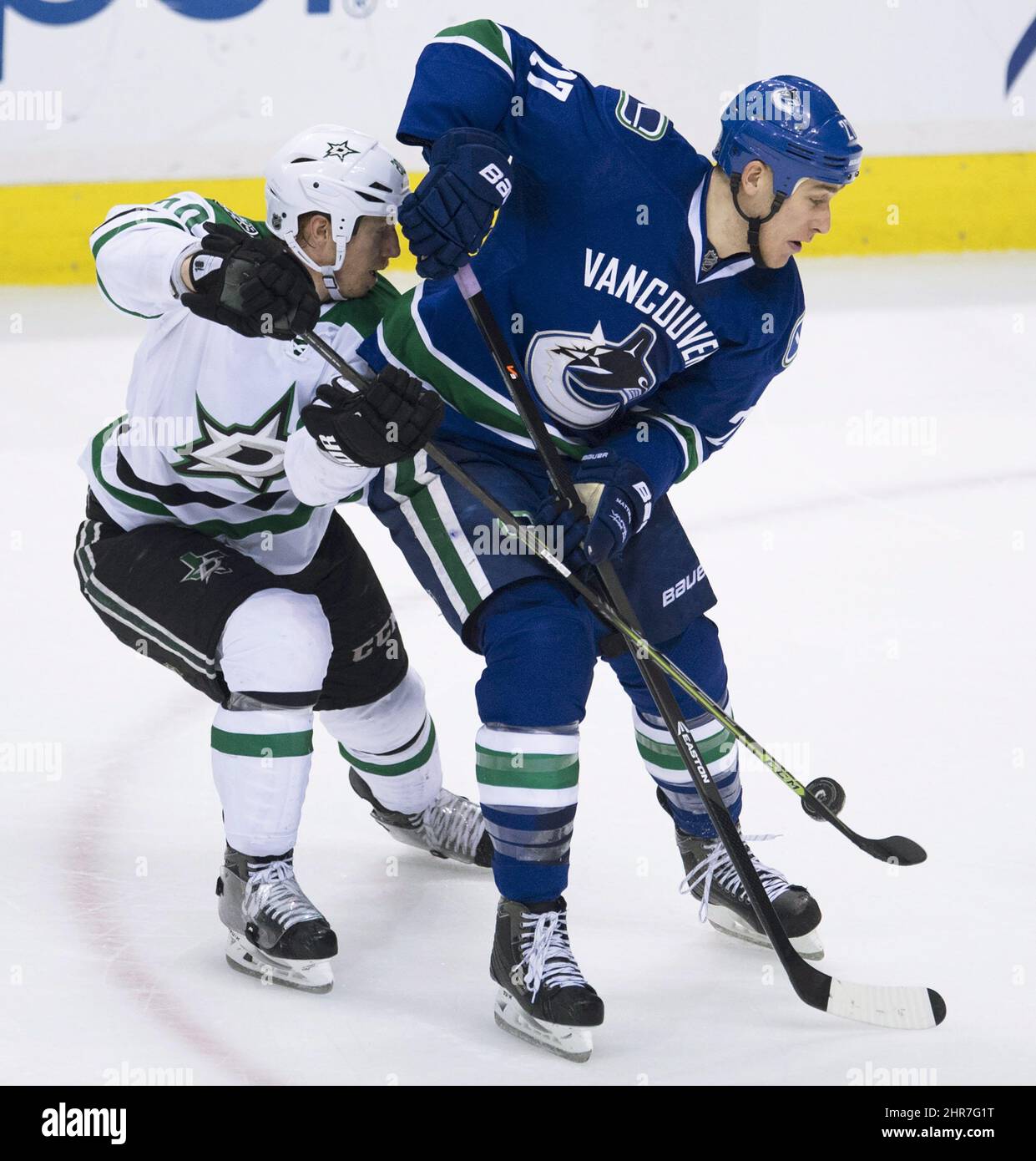Vancouver Canucks' Shawn Matthias (27) fights for control of the puck ...