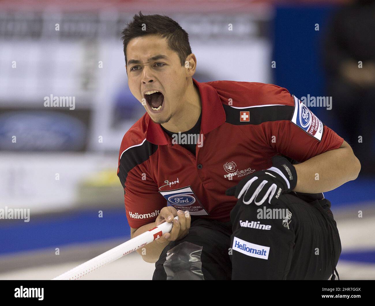 Switzerland skip Marc Pfister directs his sweepers as they play Finland ...