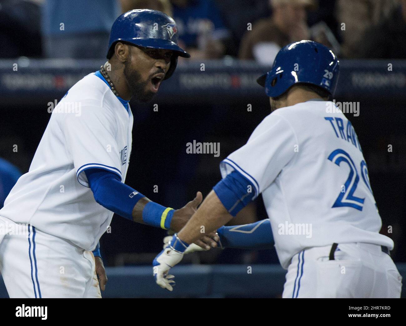 Toronto Blue Jays second baseman Devon Travis, right, celebrates his ...