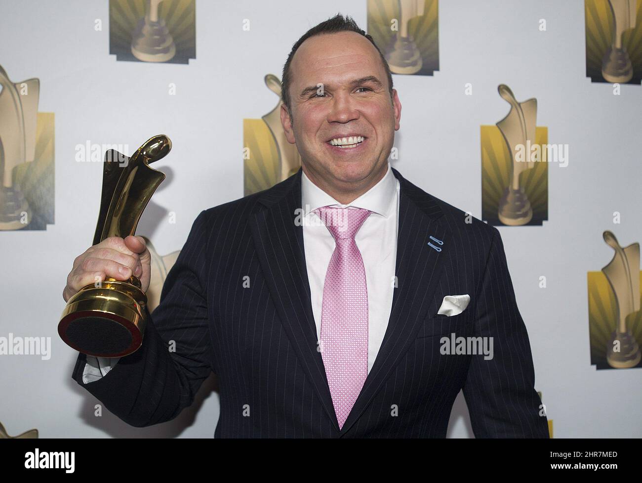 Dave Morissette holds up his trophy for best sports show presenter at ...