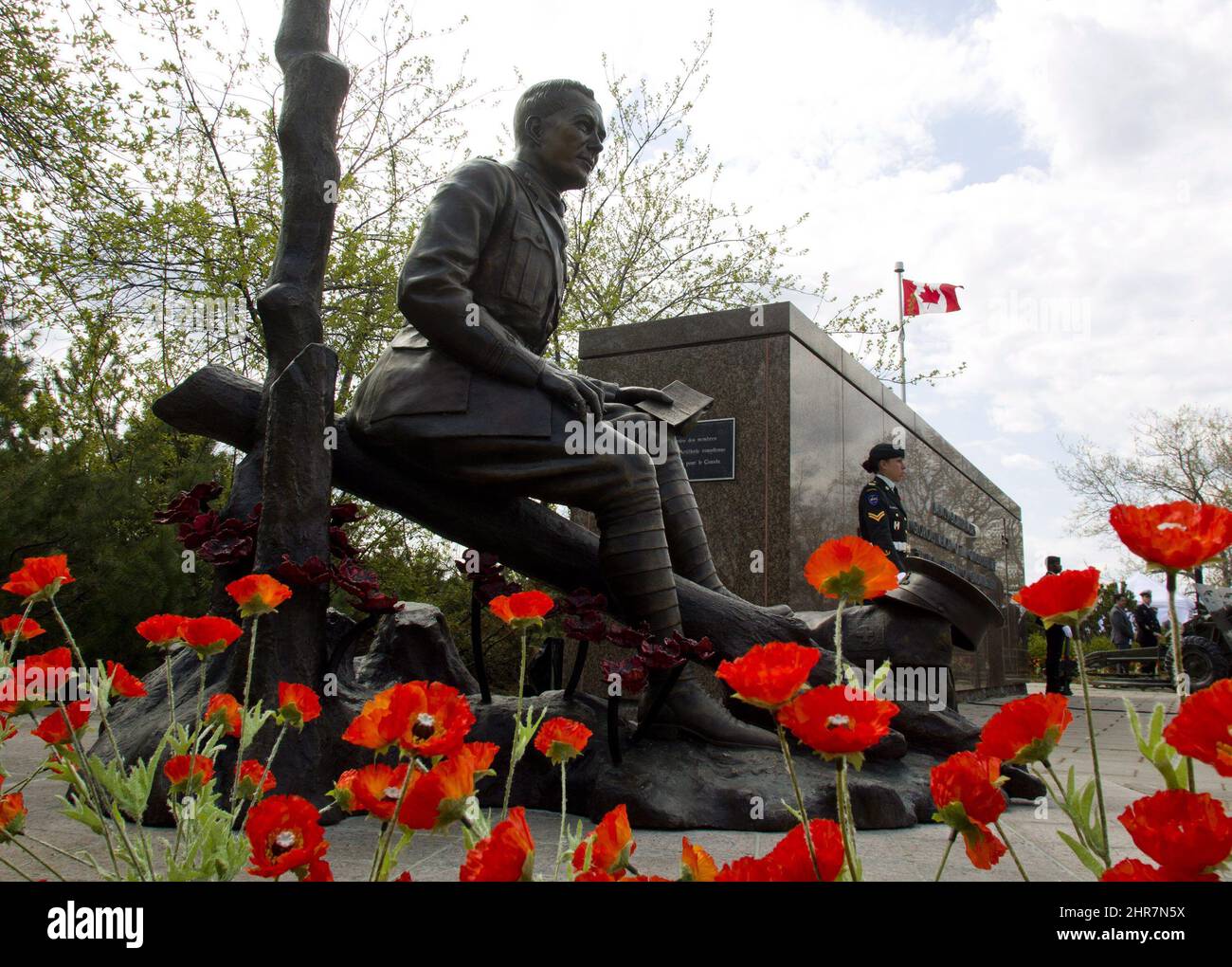 Poppies surround the newly unveiled statue of Lt.-Col. John McCrae to ...