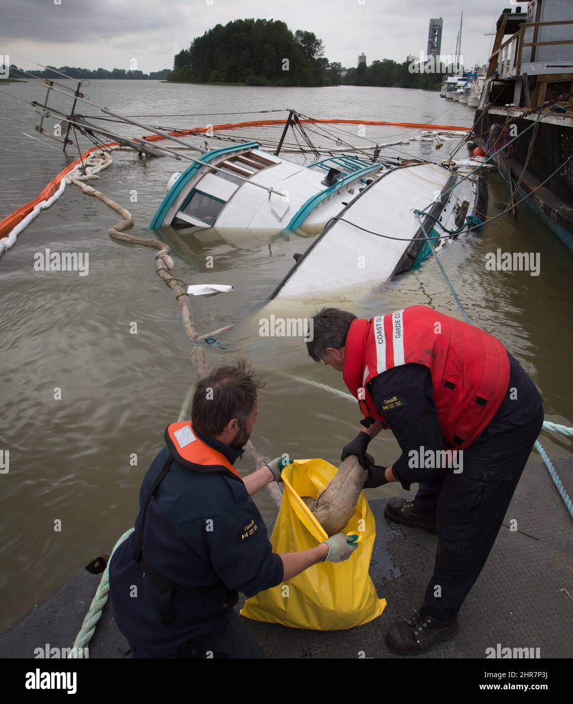 Canadian Coast Guard environmental response specialists Darryl Lastik ...