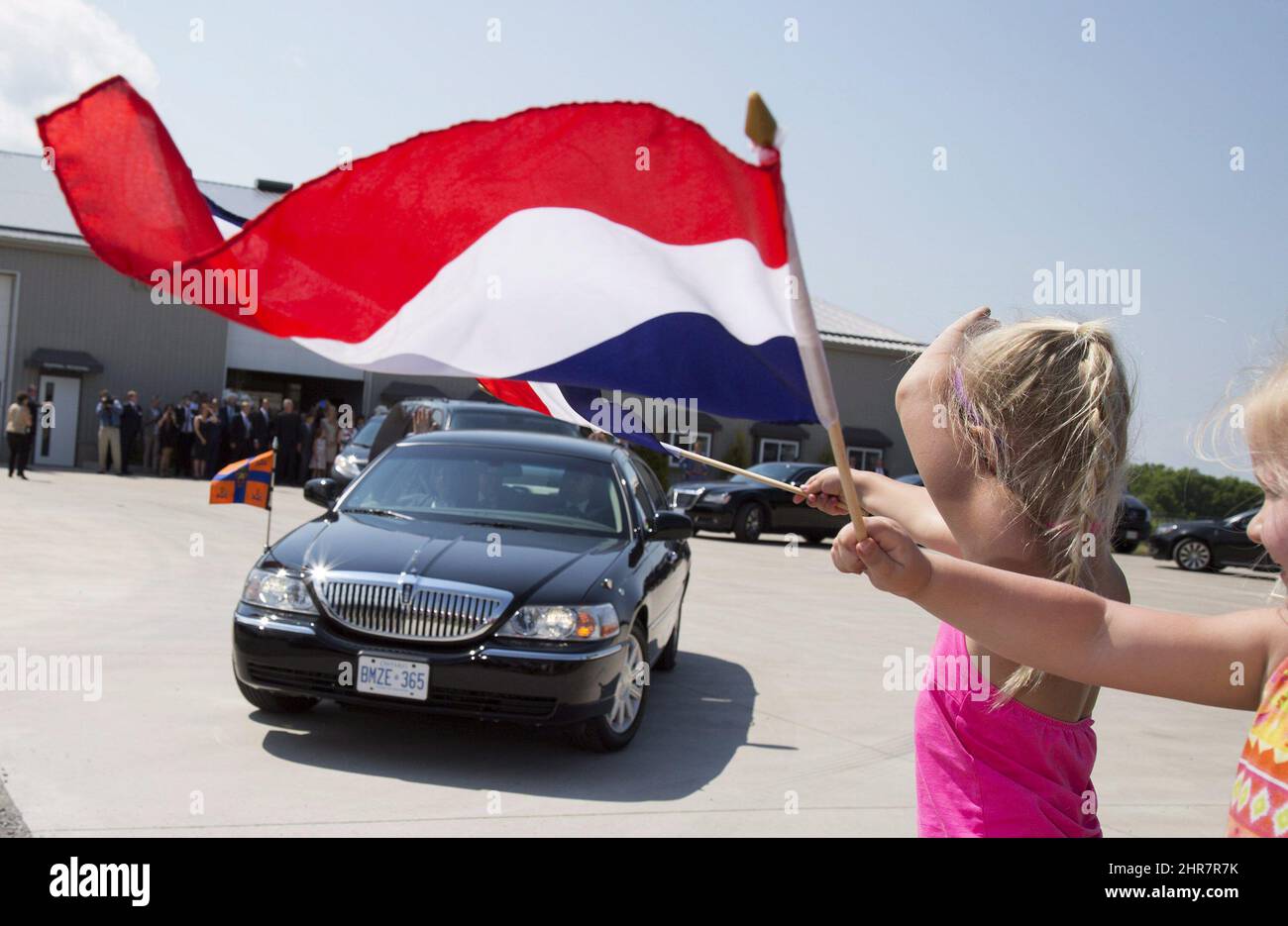 Kiley VanHuizen (right) and Sophia Postma wave goodbye to their ...