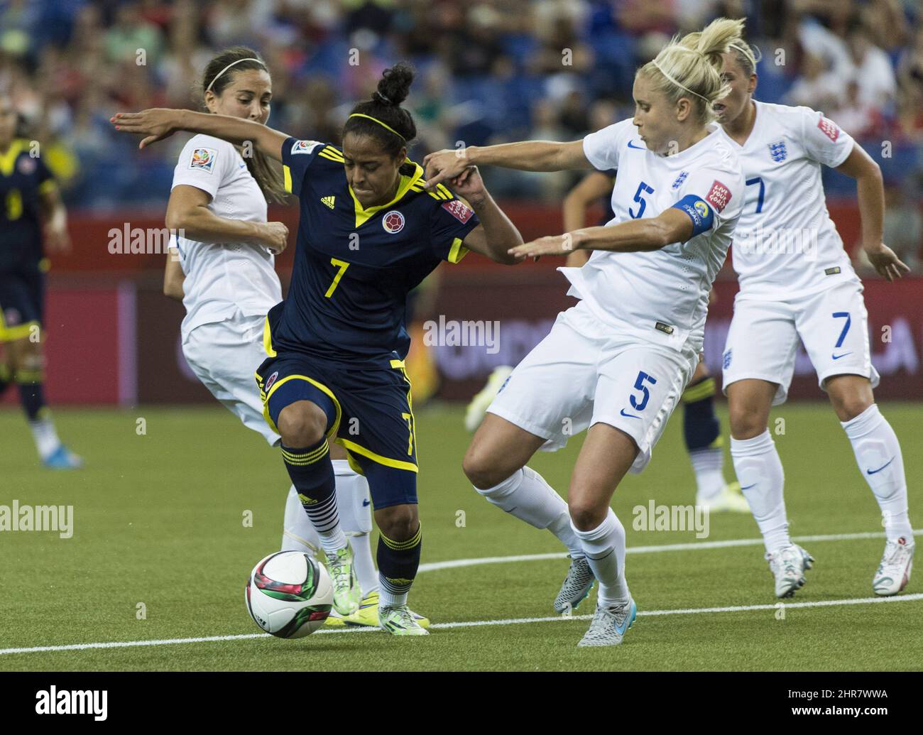 Columbia forward Ingrid Vidal breaks away from England defender Steph ...