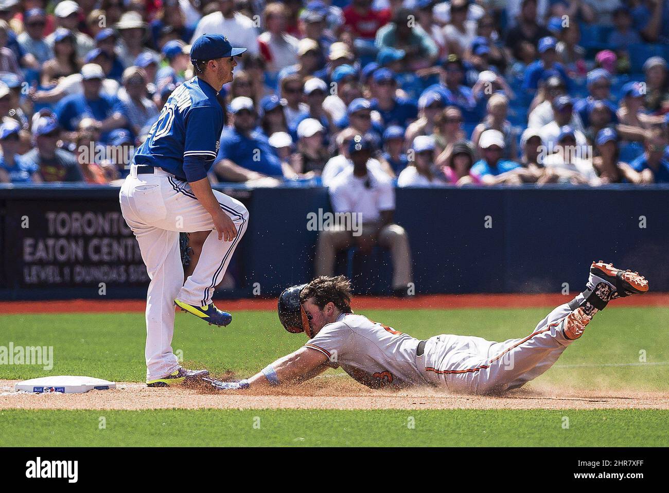 Baltimore Orioles Travis Snider slides into third base with a triple ...
