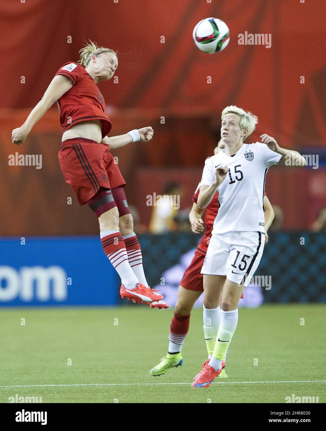 Germany's Alexandra Popp heads the ball as USA Megan Rapinoe (15 ...