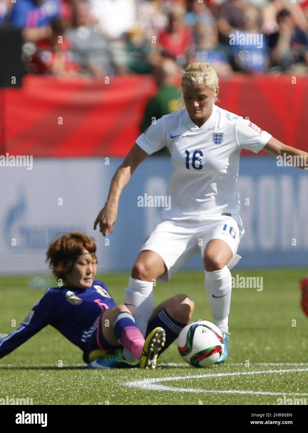 Japan's Mizuho Sakaguchi (6) tries to play the ball from the turf as ...