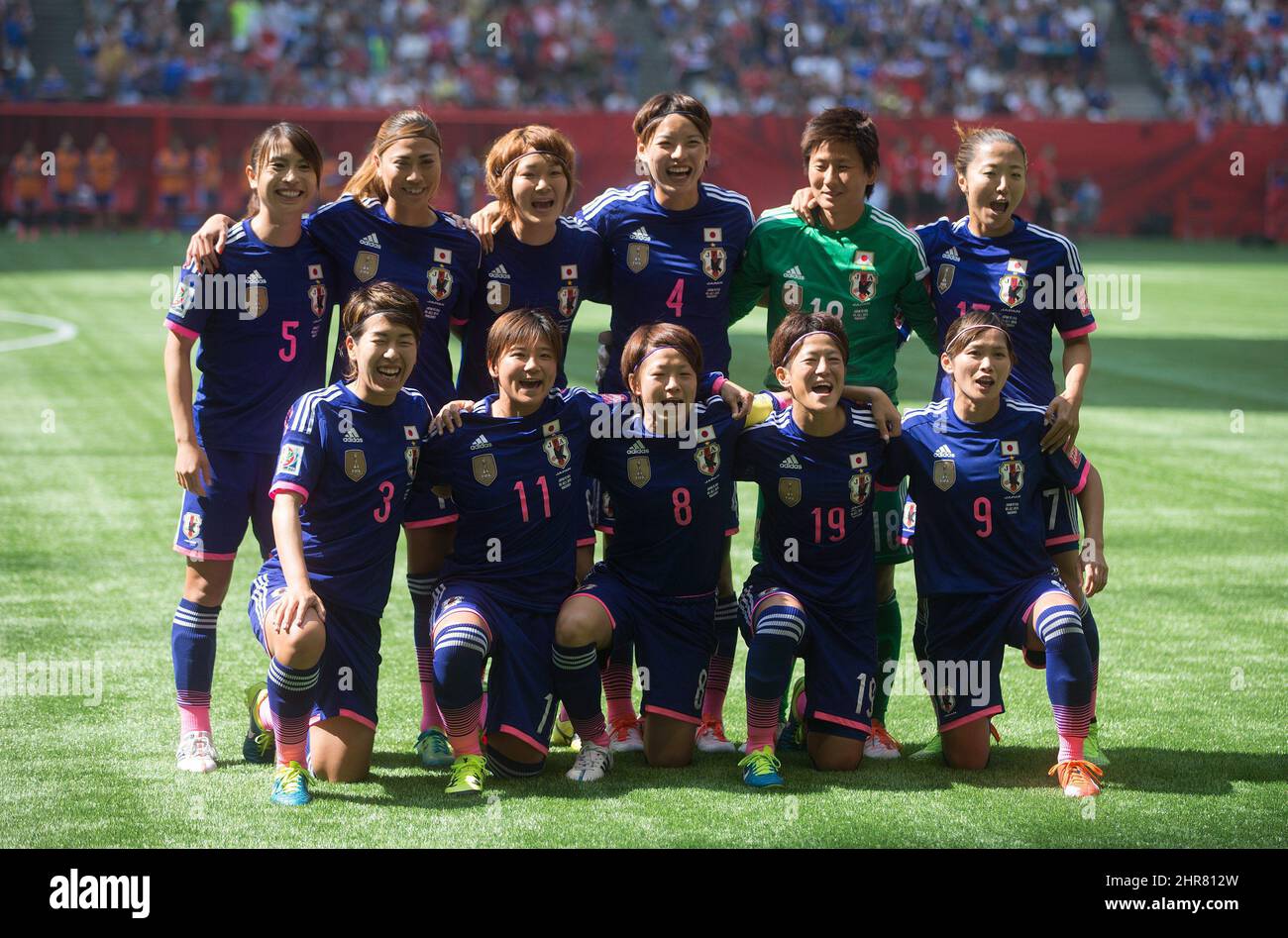 Japan players stand for a team photo before playing the United States ...