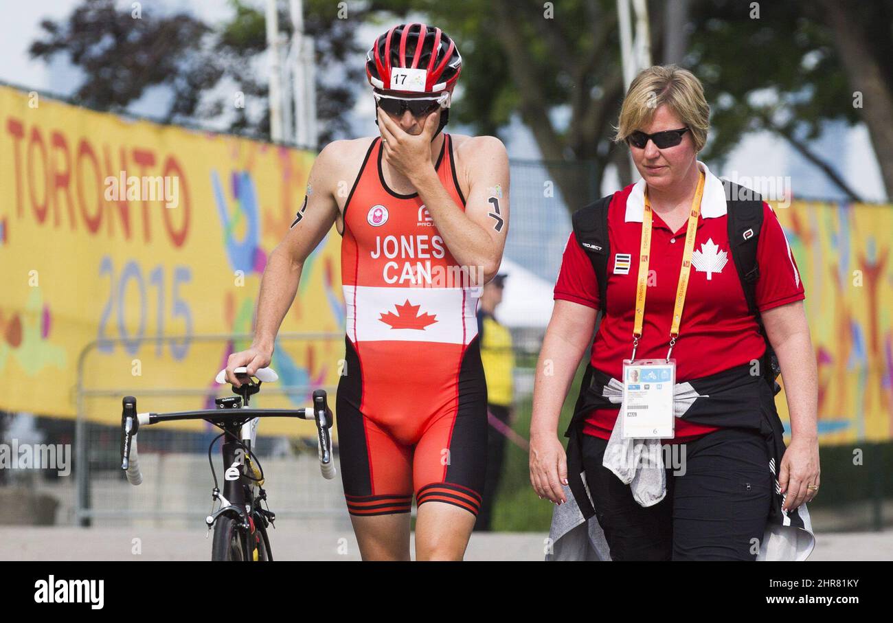 Canada's Kyle Jones walks off the course after taking himself out of ...