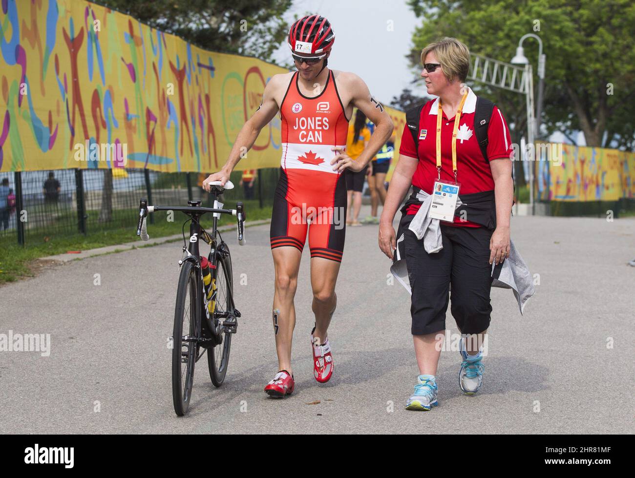 Canada's Kyle Jones walks off the course after taking himself out of ...