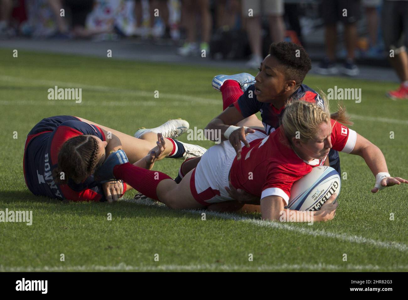 Canada's Kayla Moleschi (right) is brought down just short of the try ...