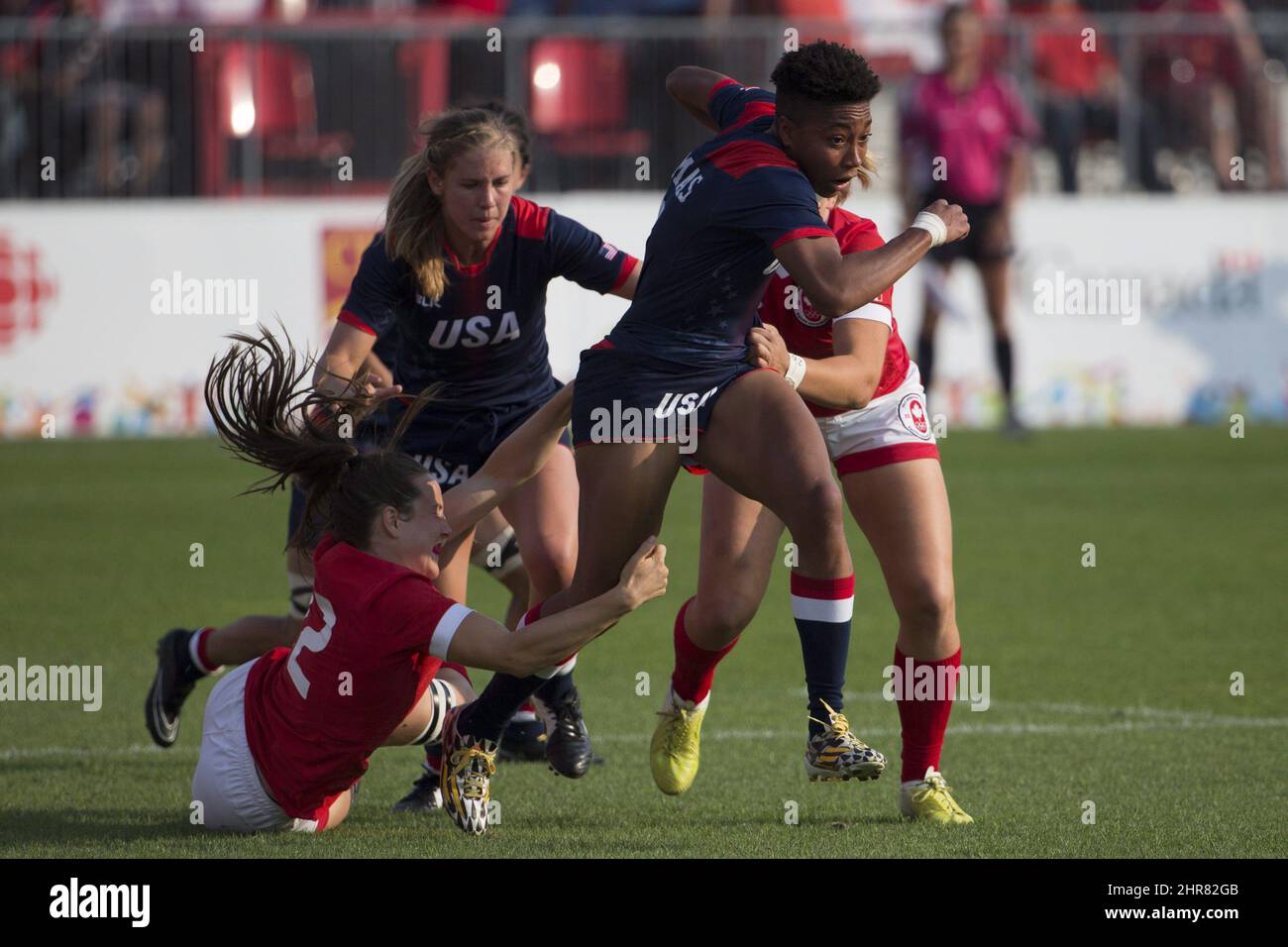 USA's Kristen Thomas tries to find a way through the Canadian defence ...