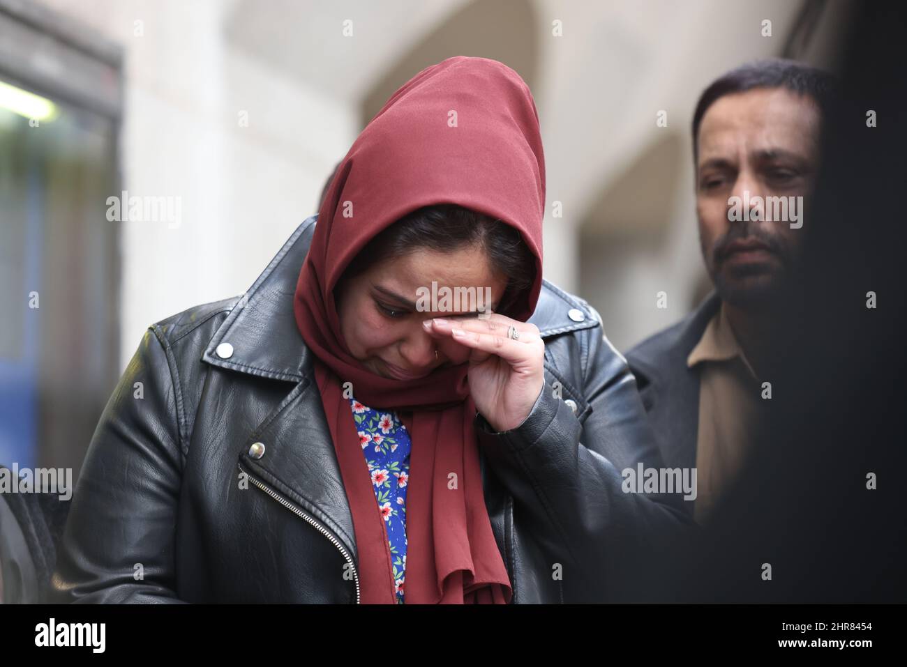 Sabrina Nessa's sister Jebina Yasmin Islam wipes away a tear whilst speaking outside the Old ...