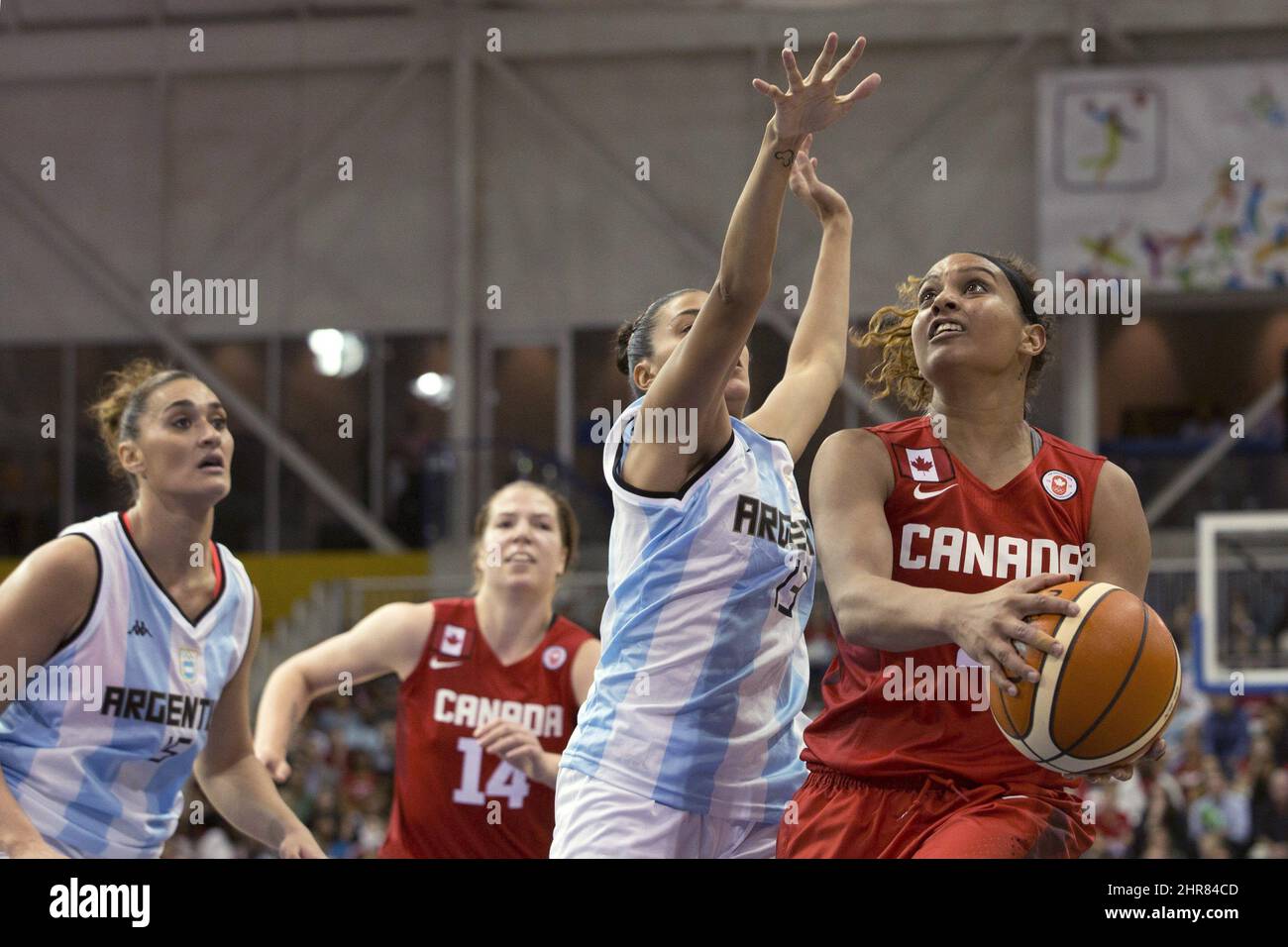 Canada's Miah Marie Langlois (right) drives past Argentina's Deborah ...