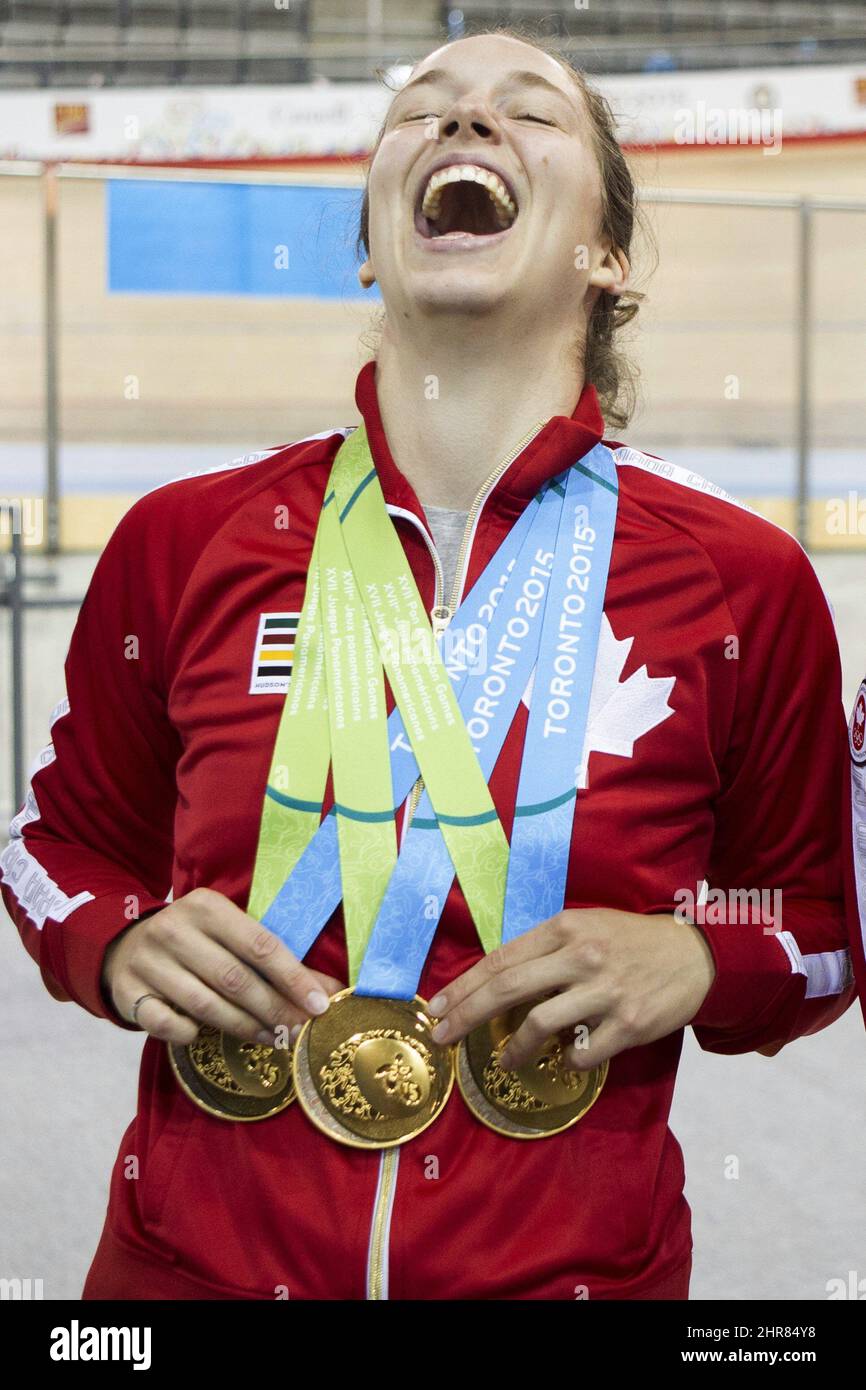Canada's Monique Sullivan stands with the three gold medals she won for ...
