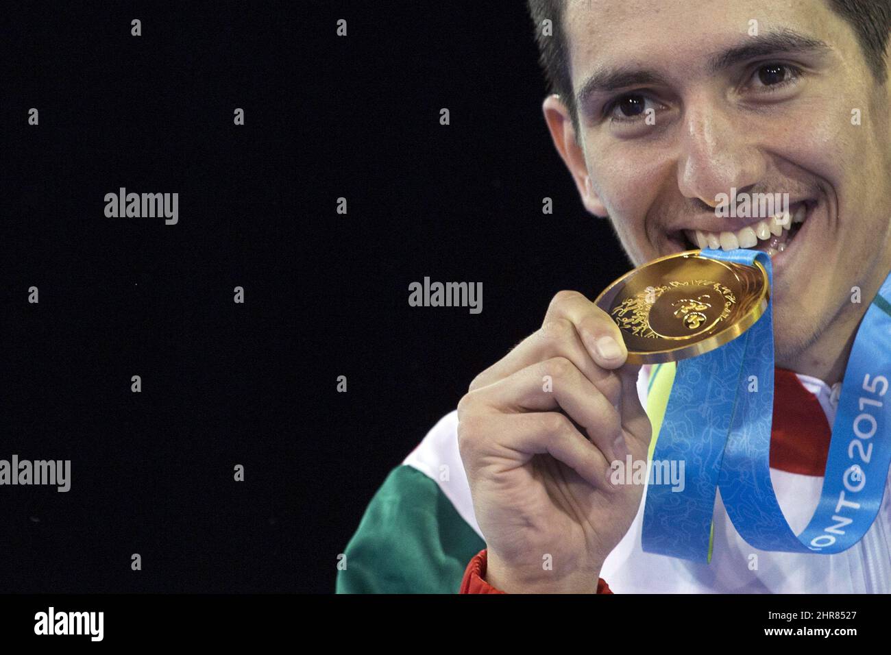 Mexico's Saul Gutierrez shows off his gold medal after beating Canada's ...