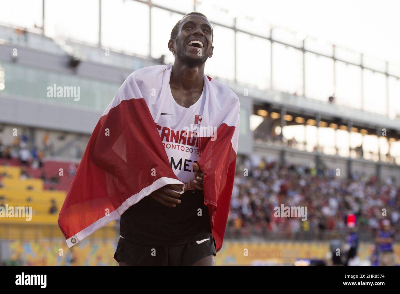 Mohammed Ahmed, of Canada, reacts after winning the men's 10000m final ...