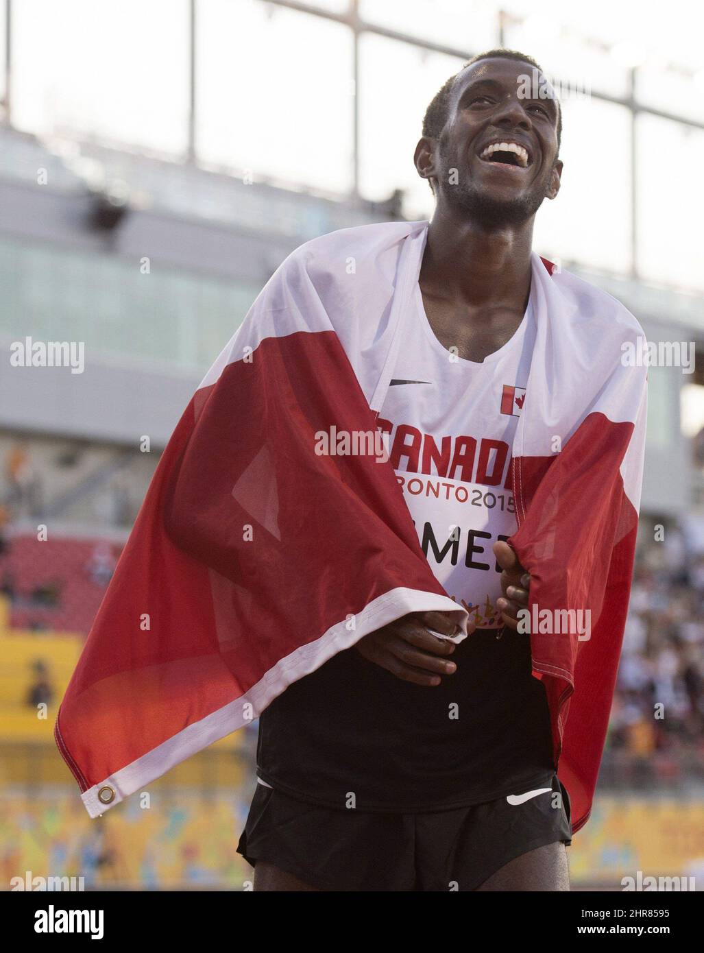 Mohammed Ahmed, of Canada, reacts after winning the men's 10000m final ...