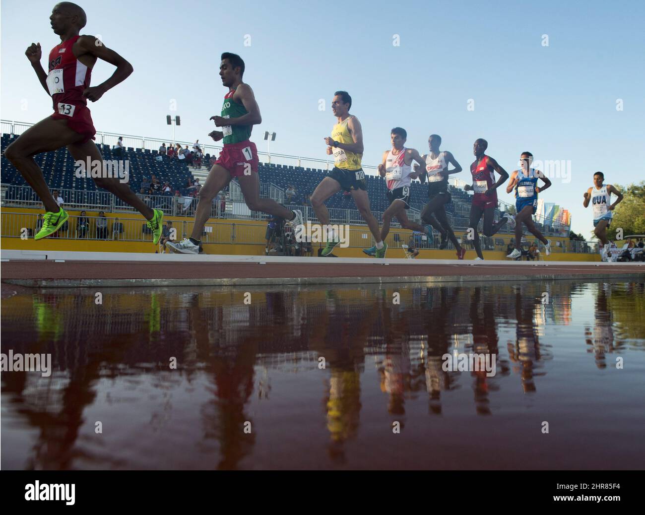 Competitors take part in the men's 10000m final during the athletics ...