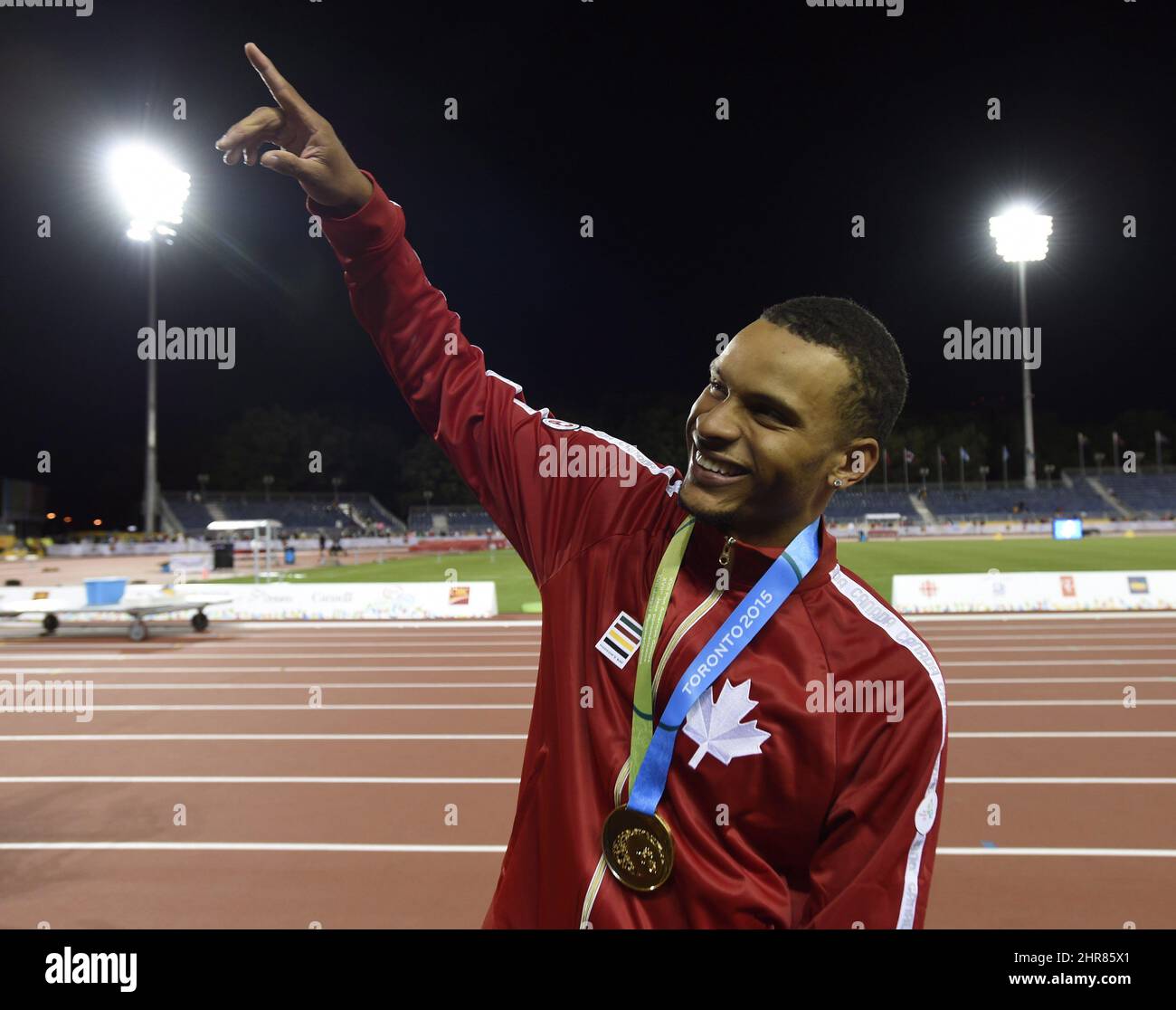 Andre De Grasse, of Canada, points to fans after he wins the gold medal ...