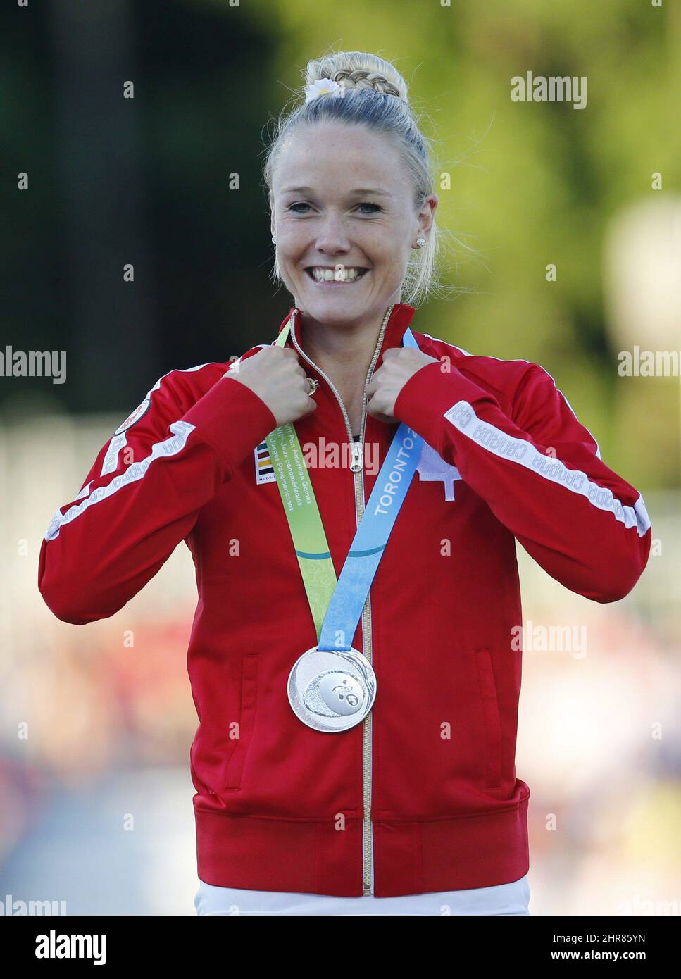 Sarah Wells, of Canada, smiles as she wears her silver medal from the ...