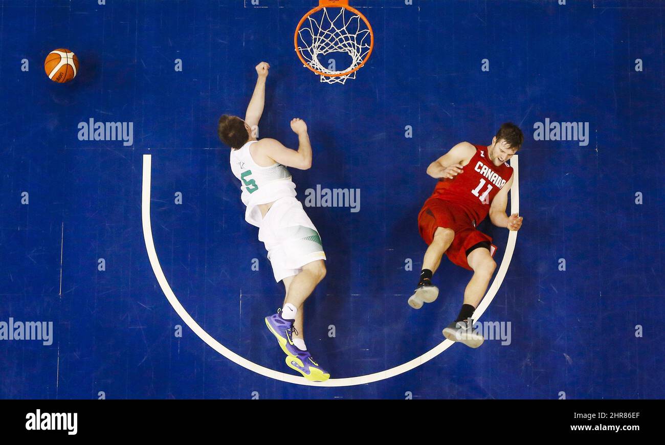 Canada's Aaron Doornekamp falls over Brazil's Rafael Freire Luz, left ...