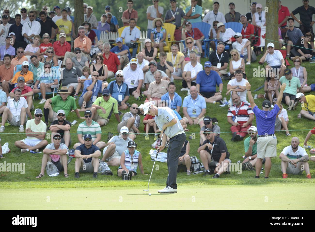 David Hearn of canada putts on the ninth green at the Canadian Open in ...