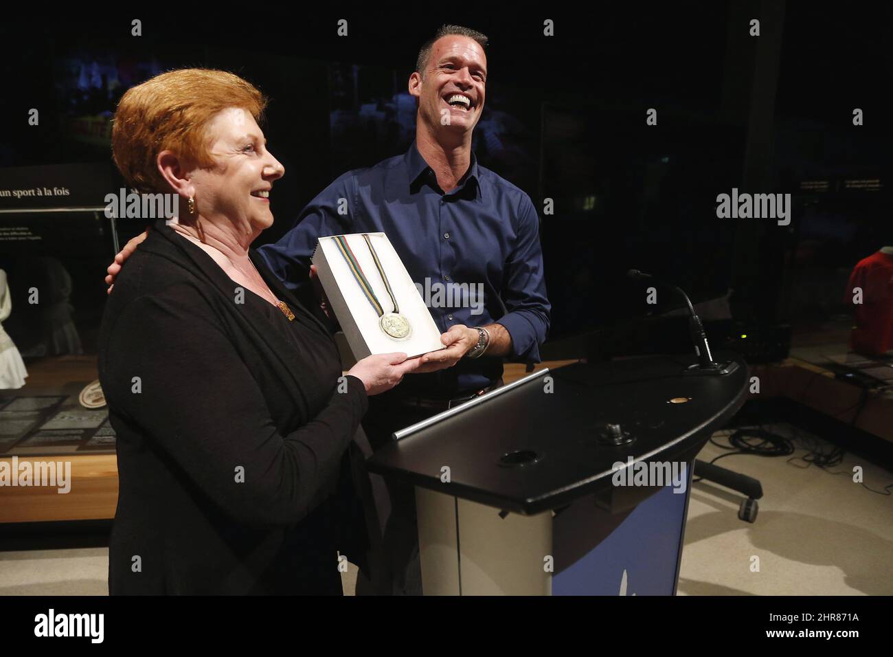 Canadian Olympian Mark Tewksbury presents his Olympic gold medal to ...