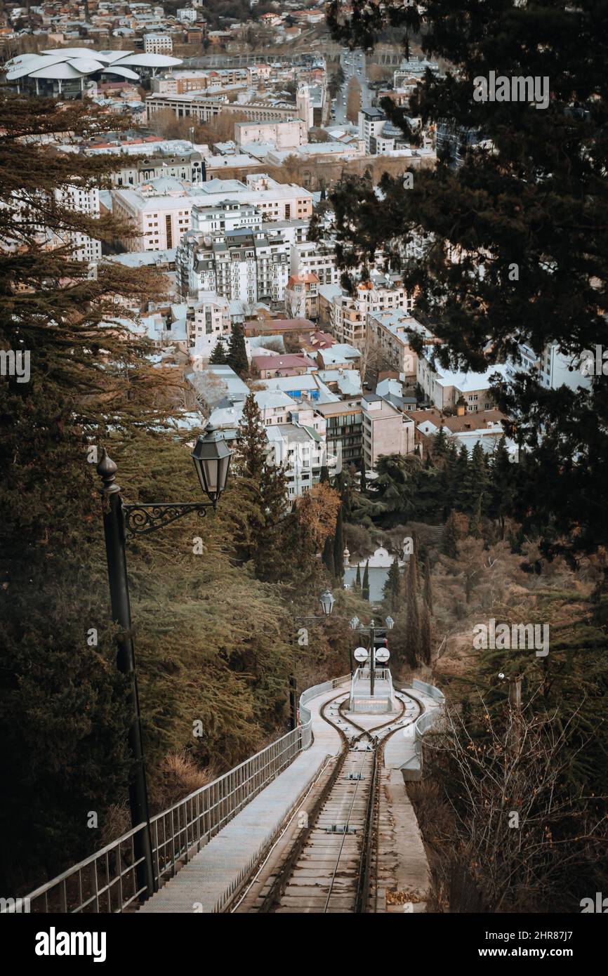Vertical shot of the Funicular road with buildings in Georgia Stock ...