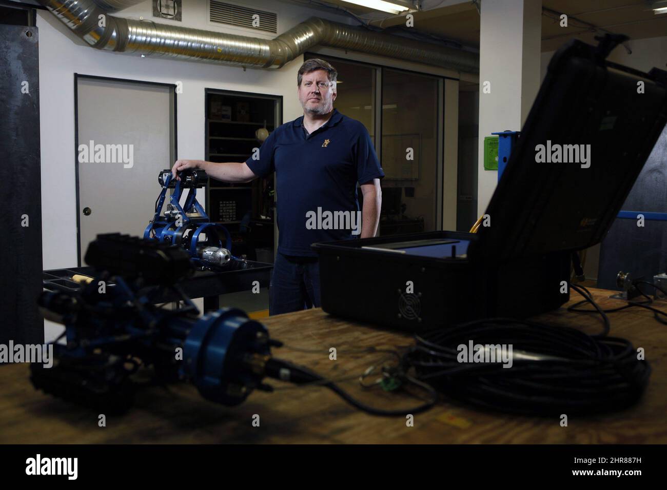 Colin Dobell, President and CEO of Inuktun, a maker of modular mobile ...