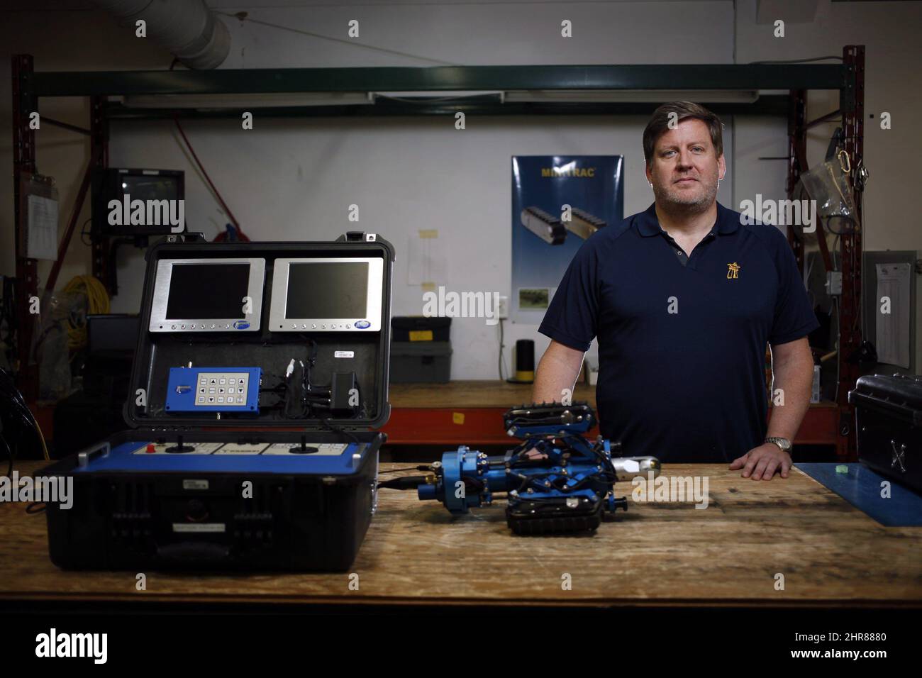 Colin Dobell, President and CEO of Inuktun, a maker of modular mobile ...