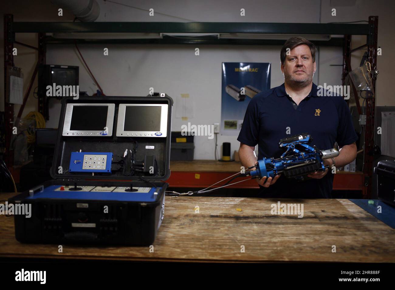 Colin Dobell, President and CEO of Inuktun, a maker of modular mobile ...